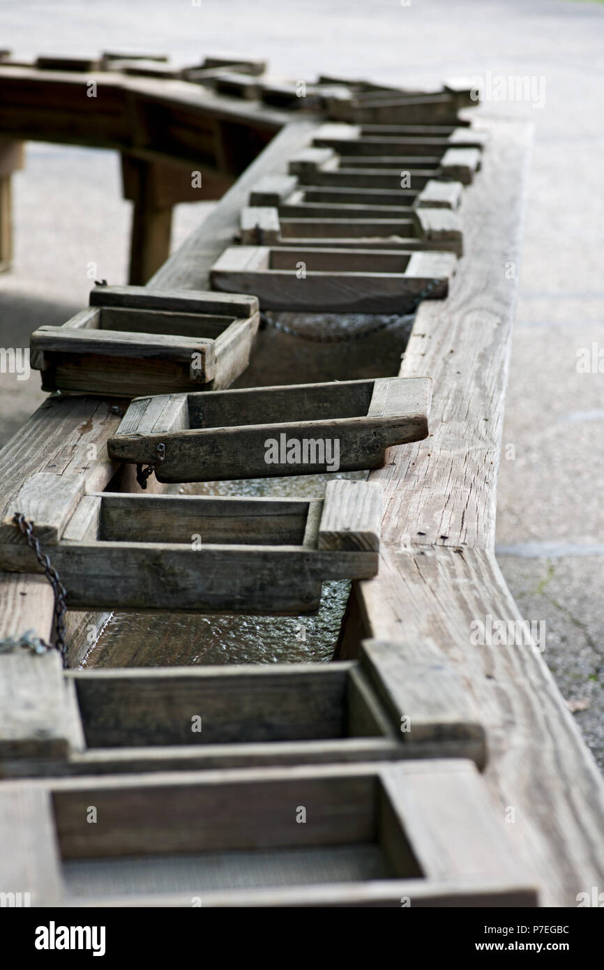 Gemstone panning with a sluice box. Sifting for stones and fossils at ...