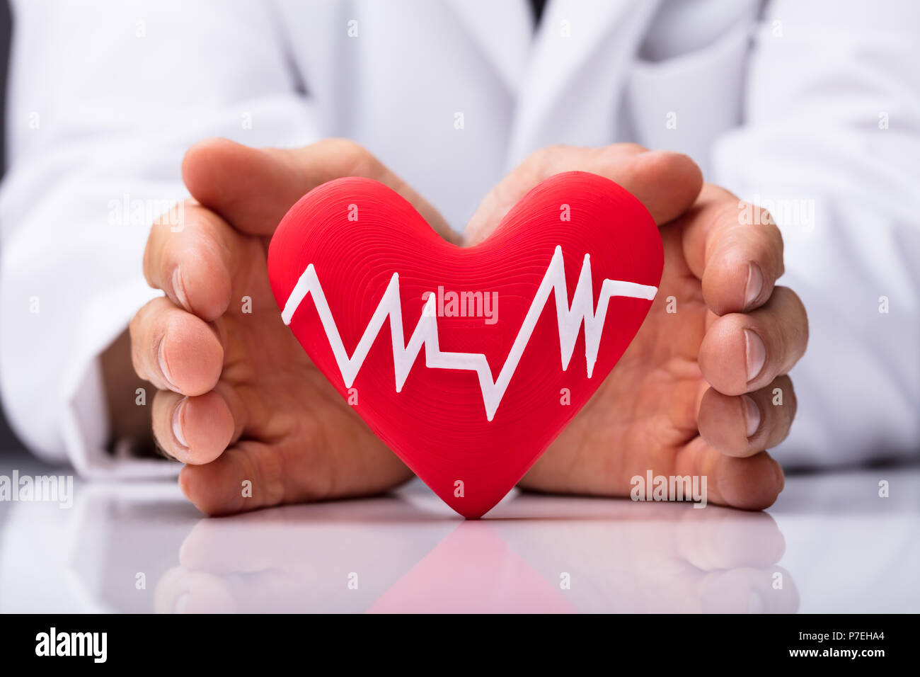 Human Hand Protecting Heart With Heartbeat Isolated On White Background ...