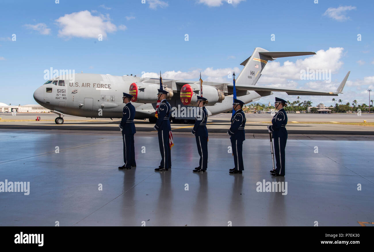 The 15th Wing Base Honor Guard prepares to present the colors during ...