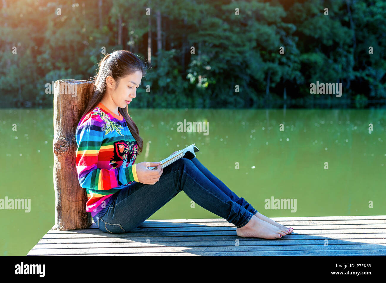 Beautiful girl reading a book Stock Photo - Alamy