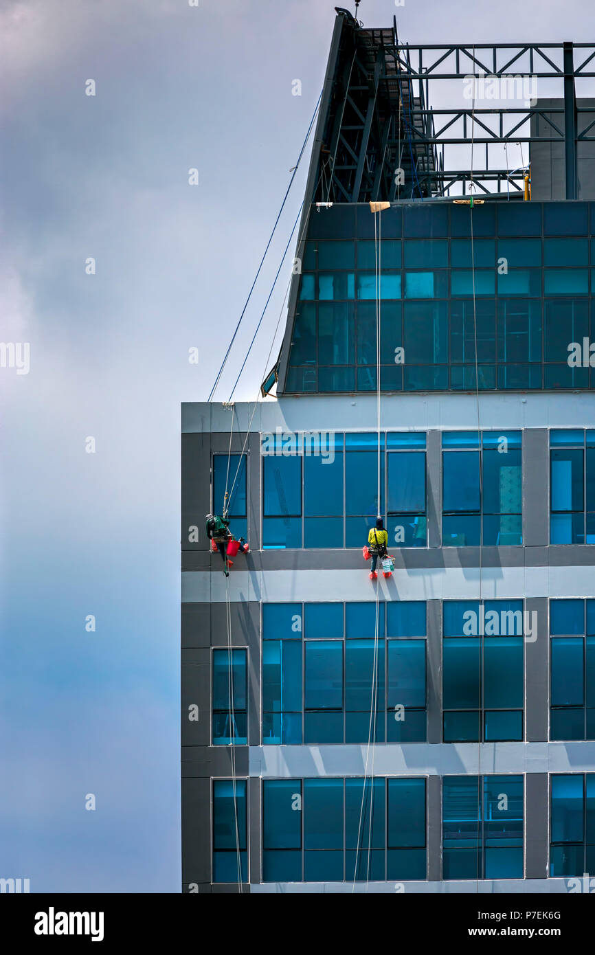 Construction workers working on high rise buildings in Bangkok ...