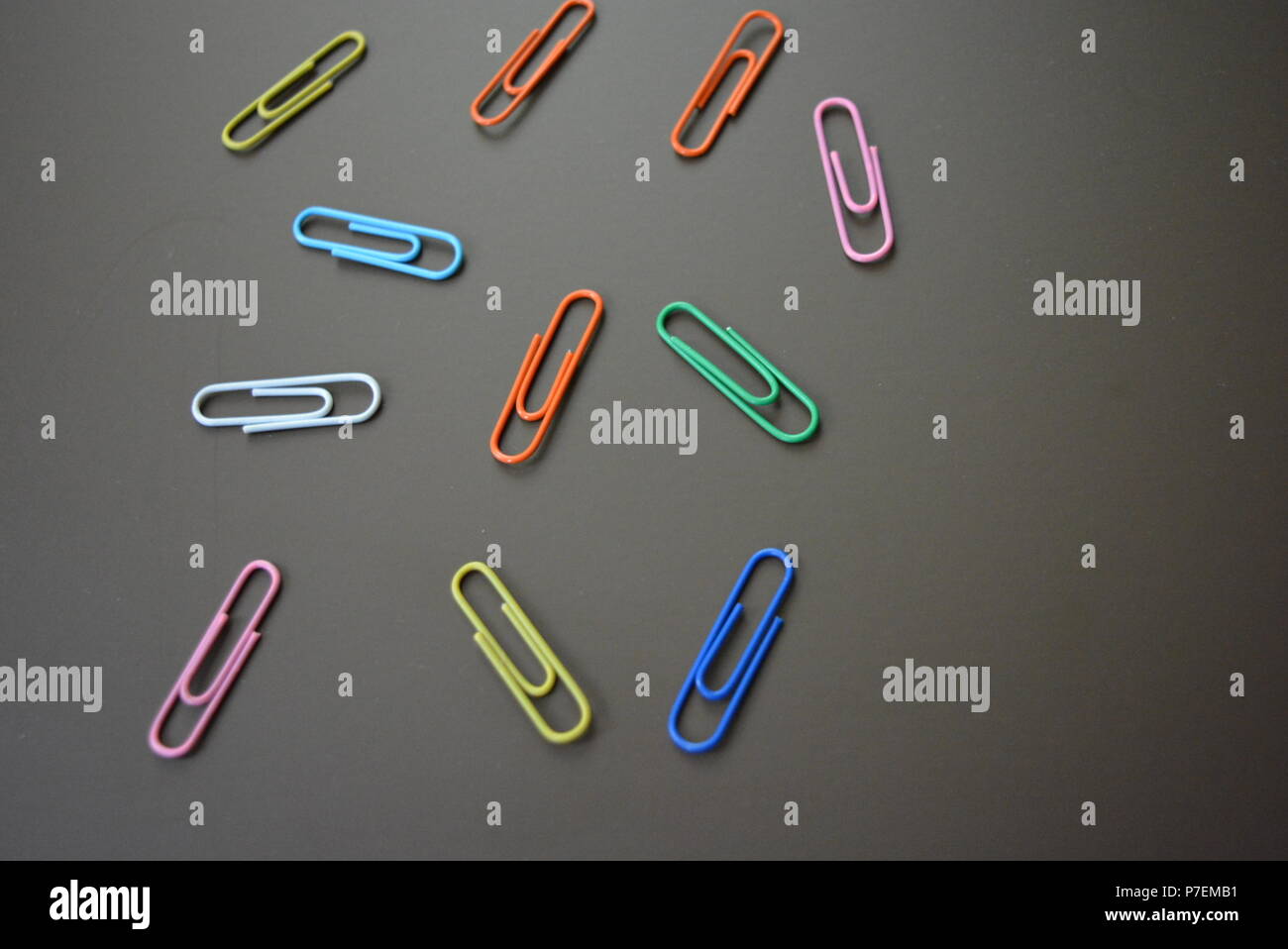 Color clips of different colors are scattered and multicolored clips ...