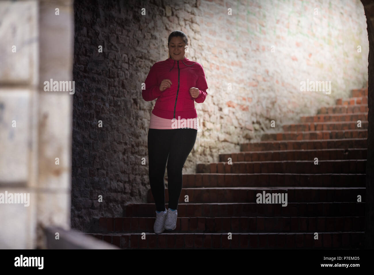 Lady running down stairs hi-res stock photography and images - Alamy