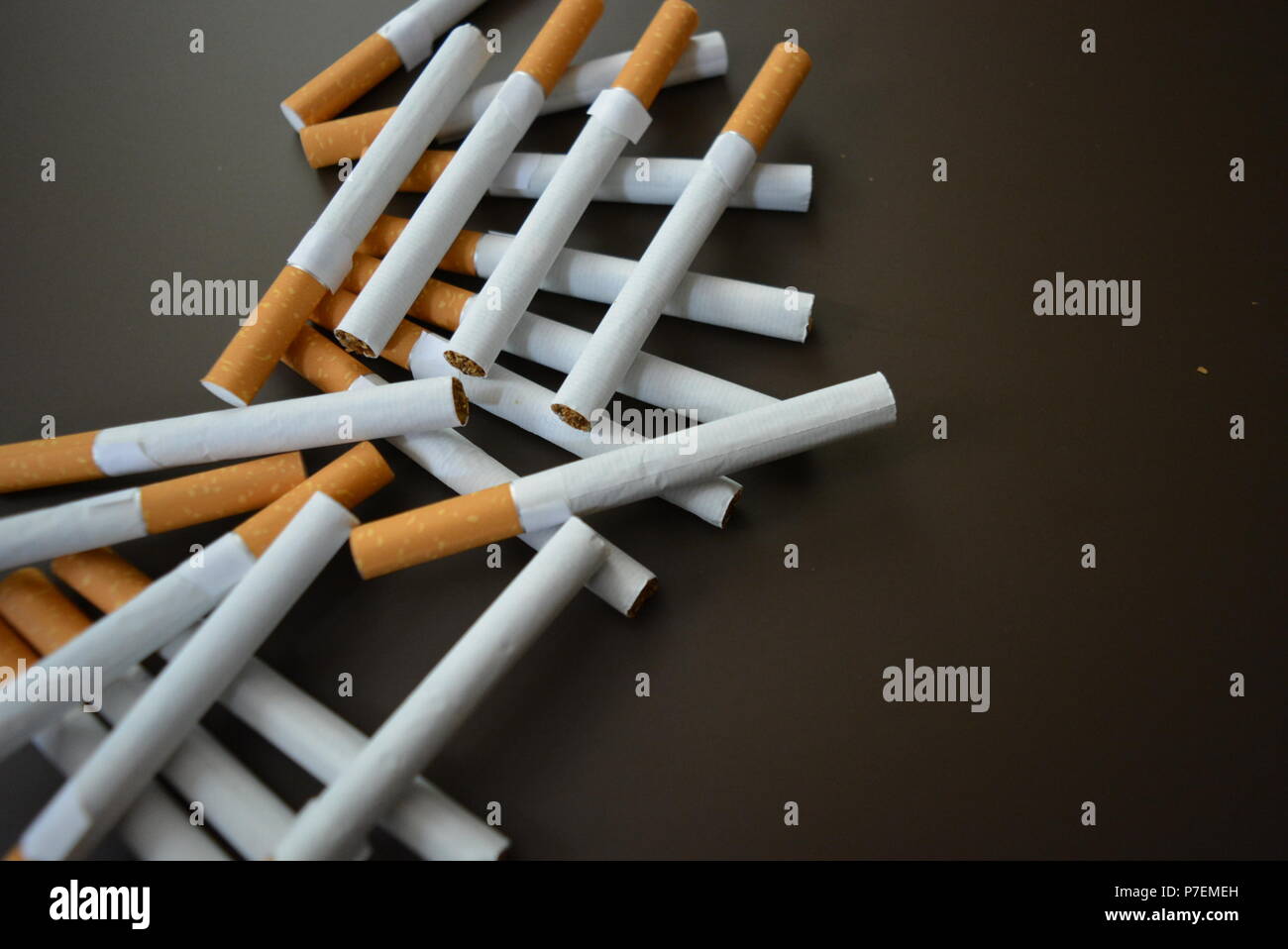 New decomposed many cigarettes on a brown matte background Stock Photo ...