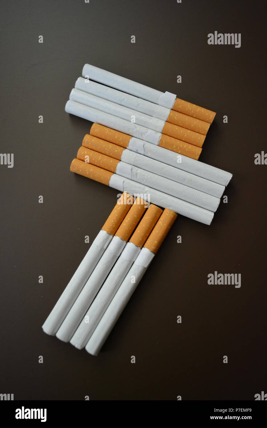 New decomposed many cigarettes on a brown matte background Stock Photo ...