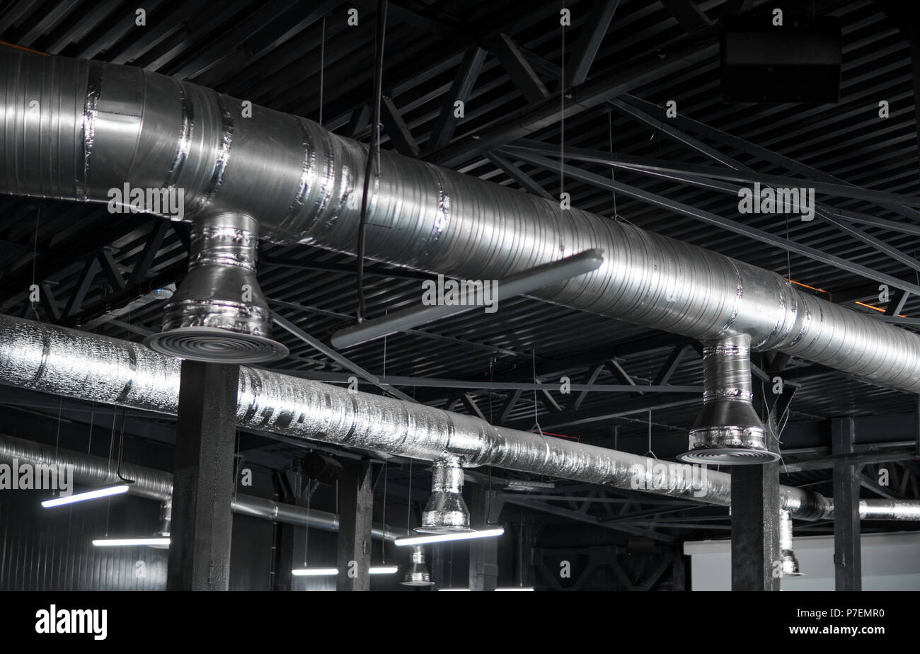 Ventilation system on the ceiling of large buildings. Ventilation pipes ...