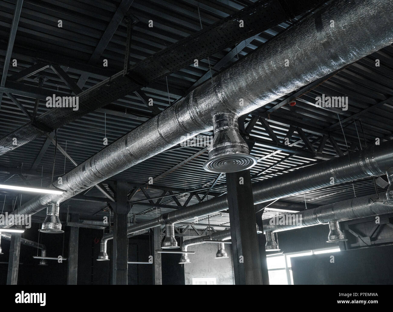 Ventilation system on the ceiling of large buildings. Ventilation pipes ...