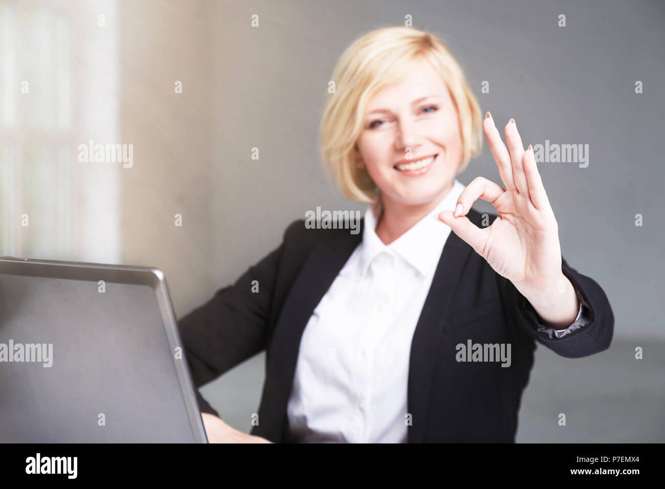 Attractive blonde secretary sitting desk hi-res stock photography and ...