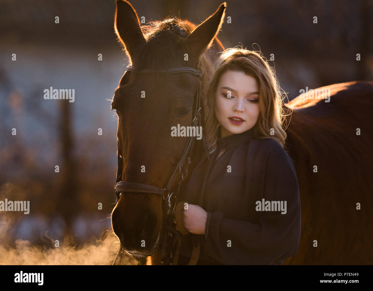 Young beautiful elegance modern woman posing with horse Stock Photo - Alamy