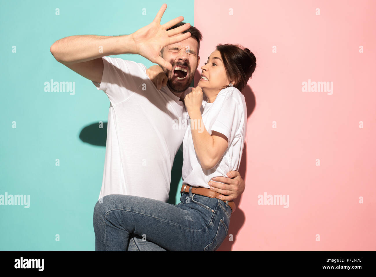 Portrait of the scared man and woman on pink and blue Stock Photo - Alamy