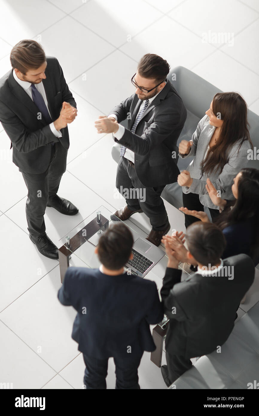 Positive colleagues giving high five Stock Photo - Alamy
