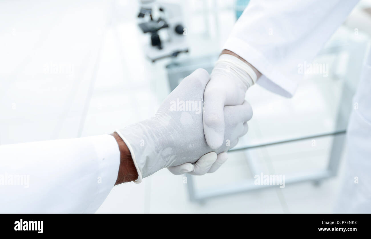 Surgical gloves handshake hi-res stock photography and images - Alamy