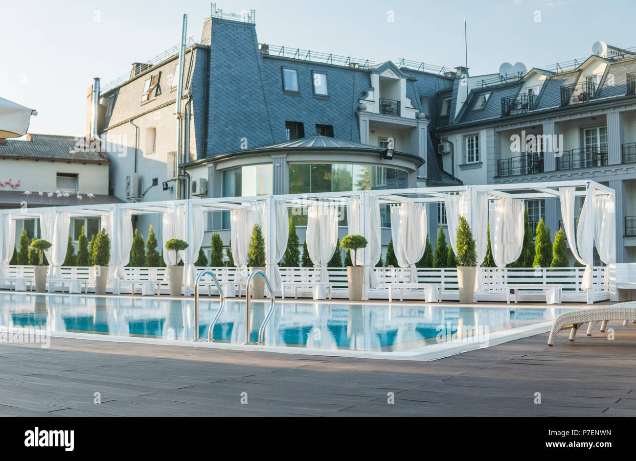 Outdoor sunny swimming pool of luxury hotel and resort with a ...