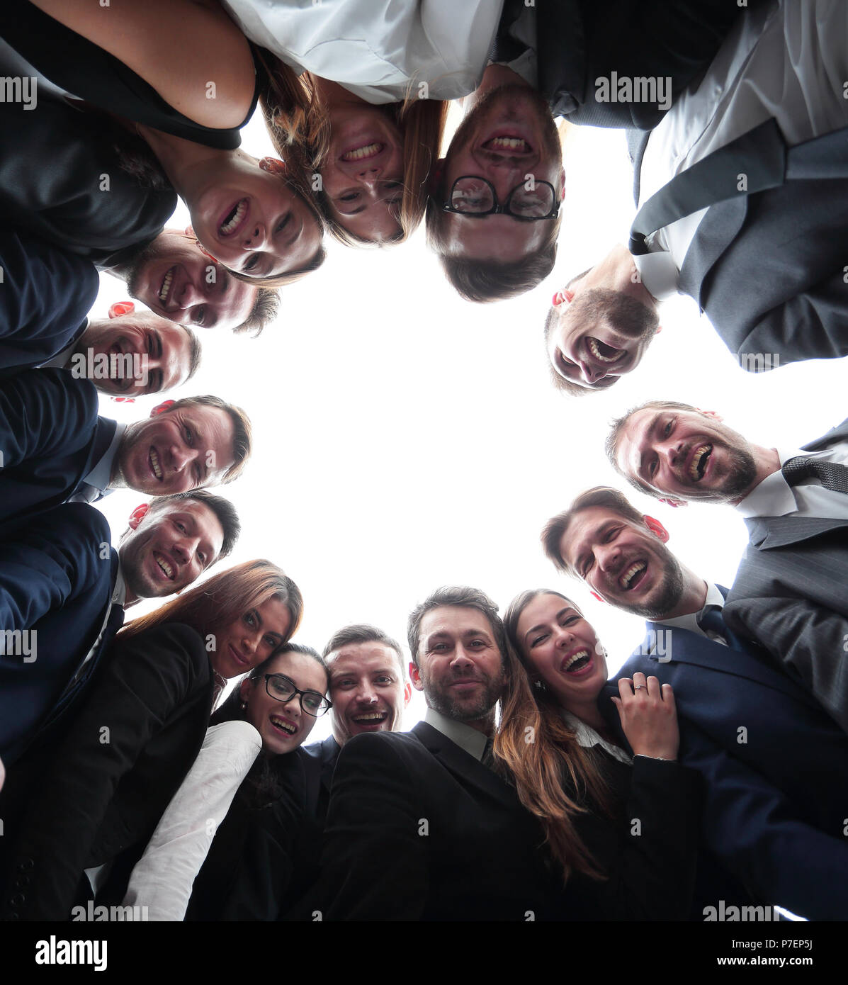 large business team is forming a circle and looking at the camera Stock ...