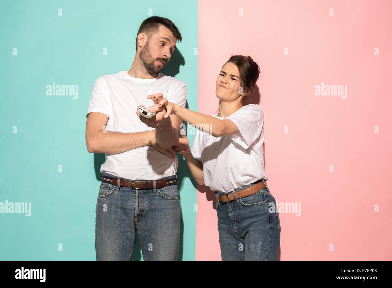 Fighting for the tv remote hi-res stock photography and images - Alamy