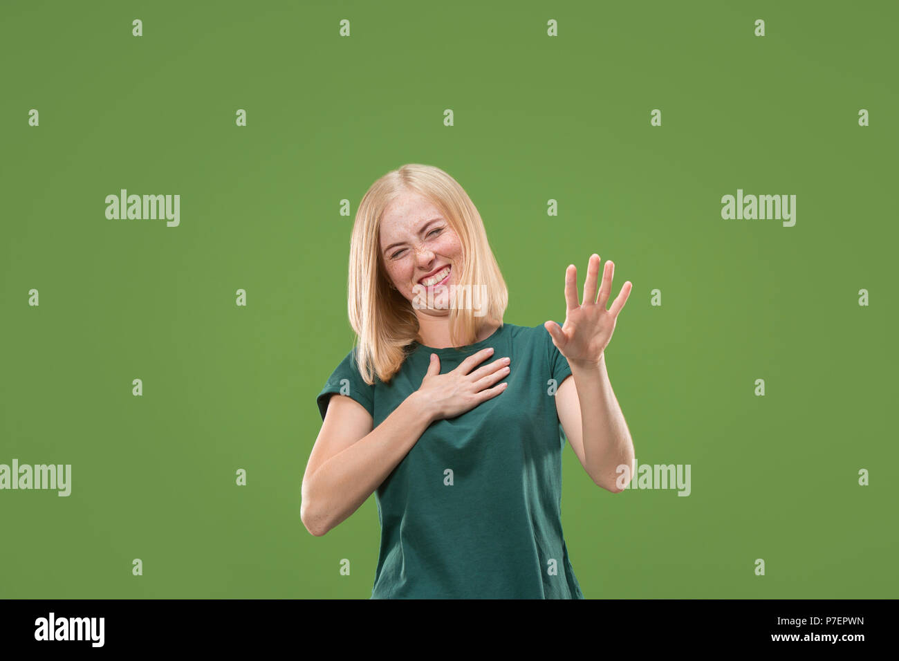 happy woman. image of female model on green Stock Photo - Alamy