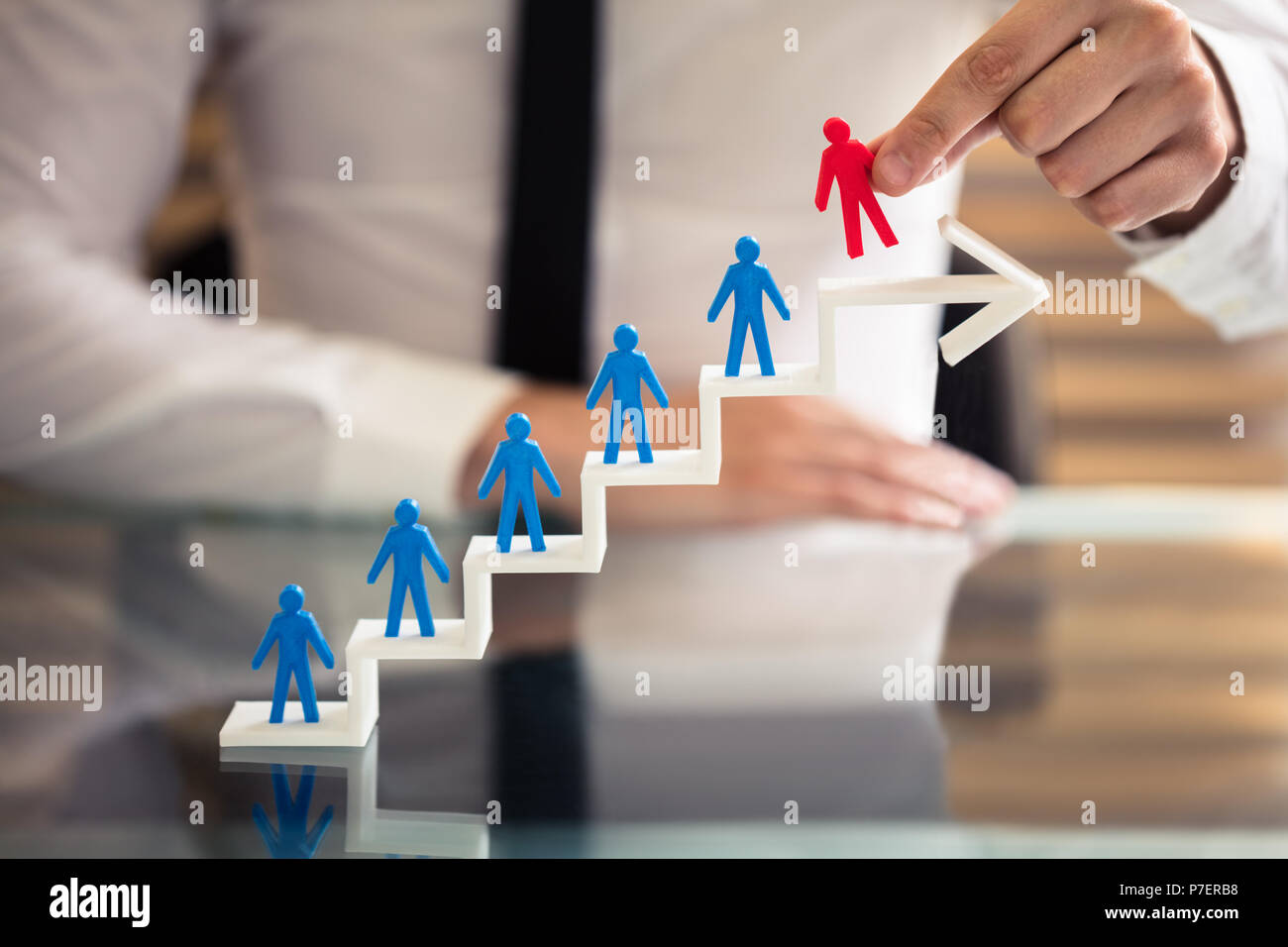 Businessperson Picking Red Human Figure From Staircase Made Of Arrow ...