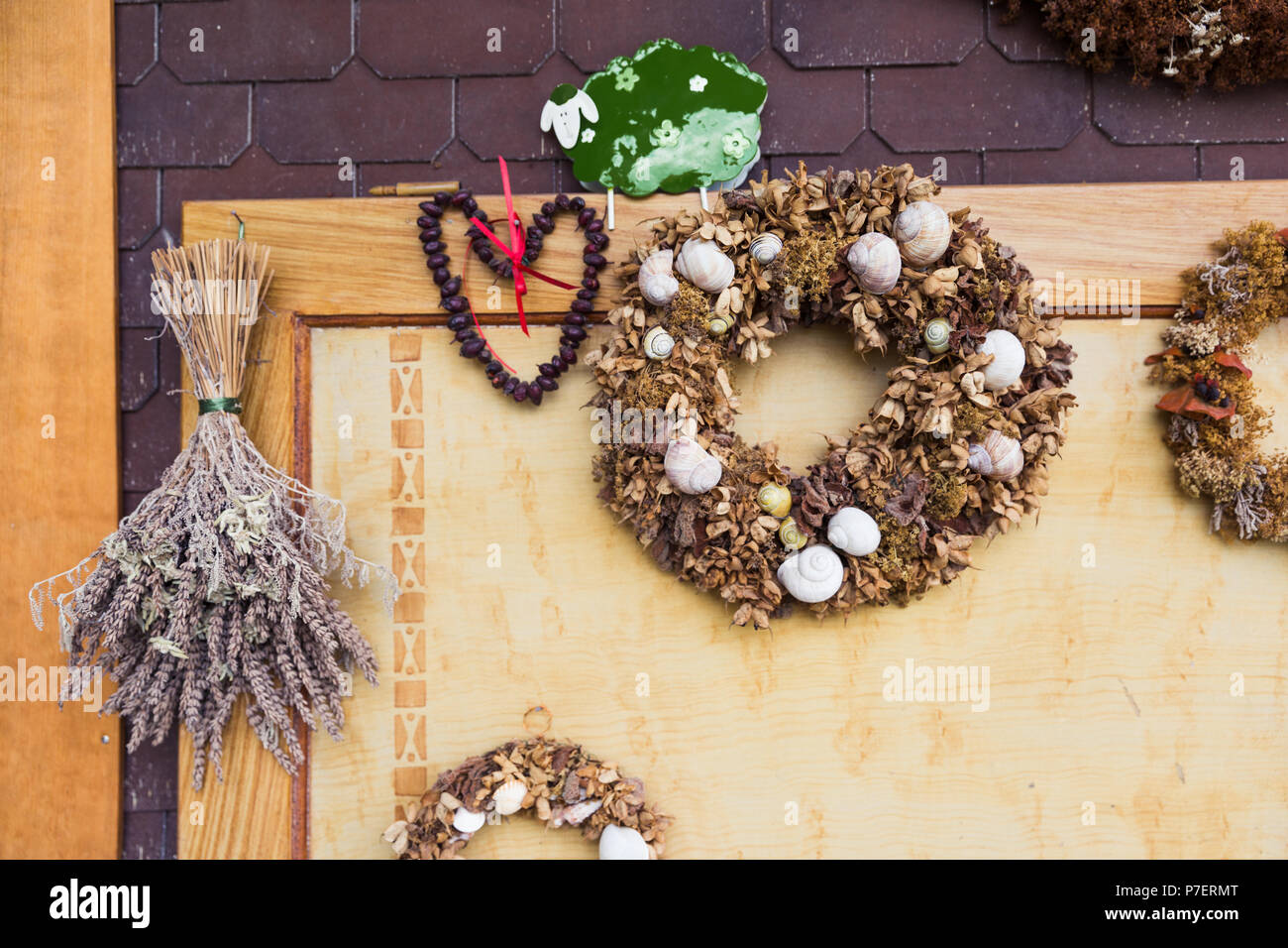 Home made Dried Flowers Crown and Snails Decorations Stock Photo - Alamy