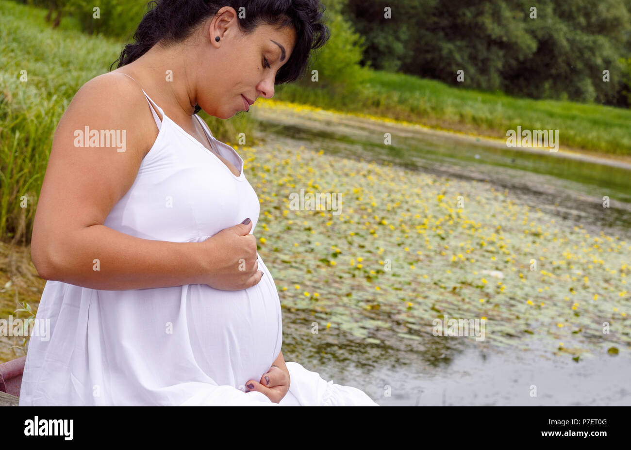 Smiling pregnant woman enjoying hi-res stock photography and images - Alamy