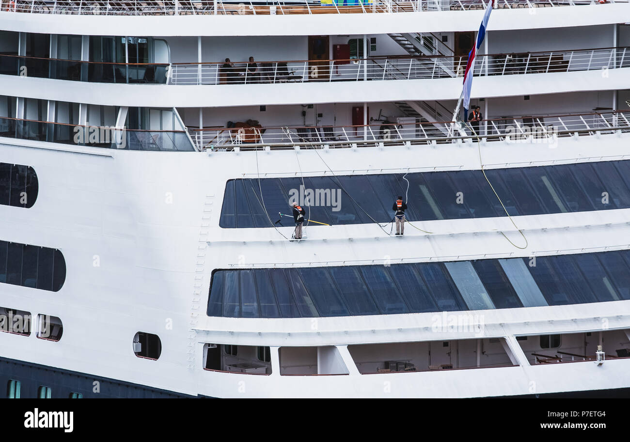 Two Men Washing Windows on Cruise Ship Stock Photo - Alamy