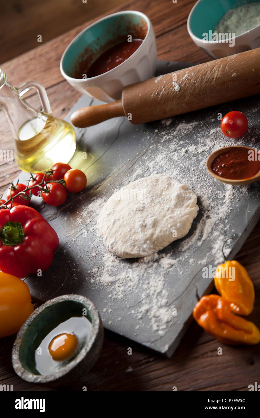 Homemade italian pizza preparation Stock Photo - Alamy