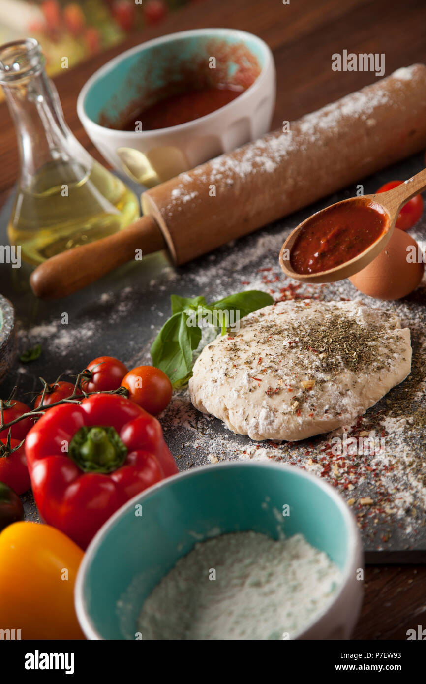 Homemade italian pizza preparation Stock Photo - Alamy