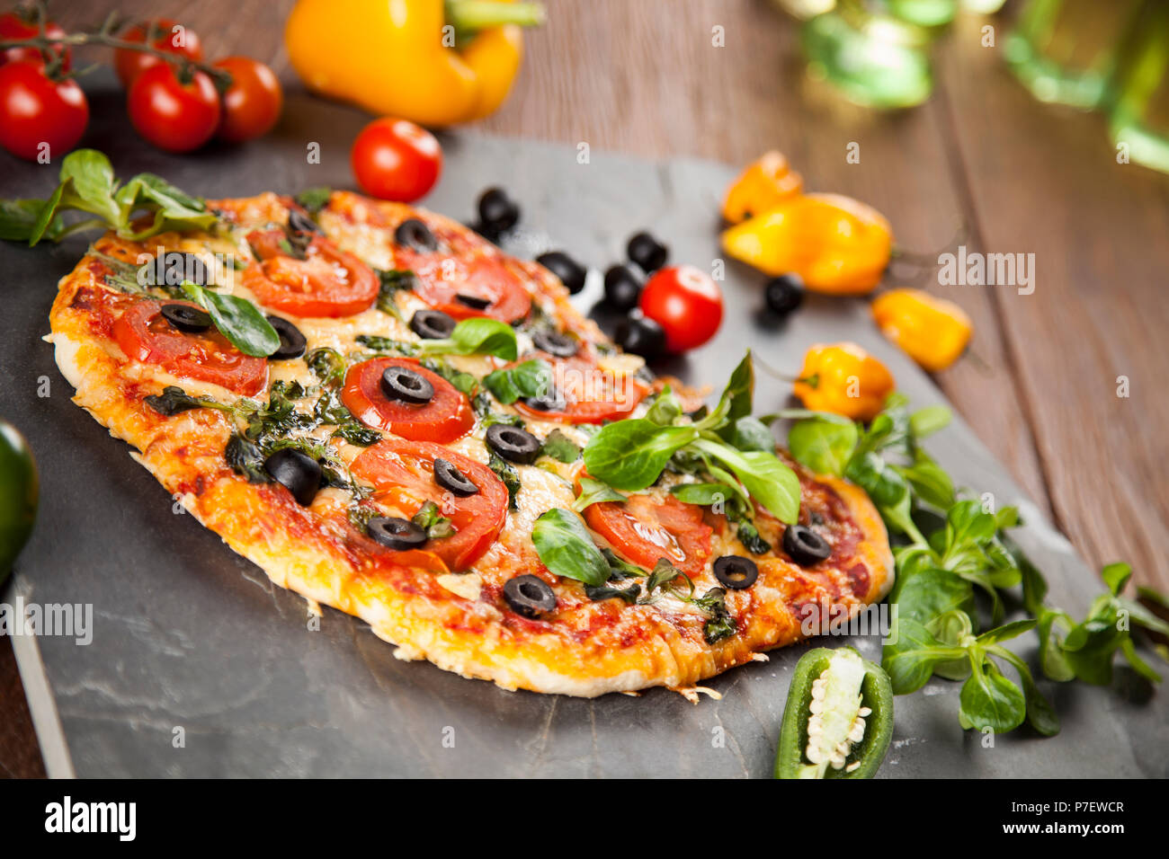 Delicious pizza served on wooden table Stock Photo - Alamy