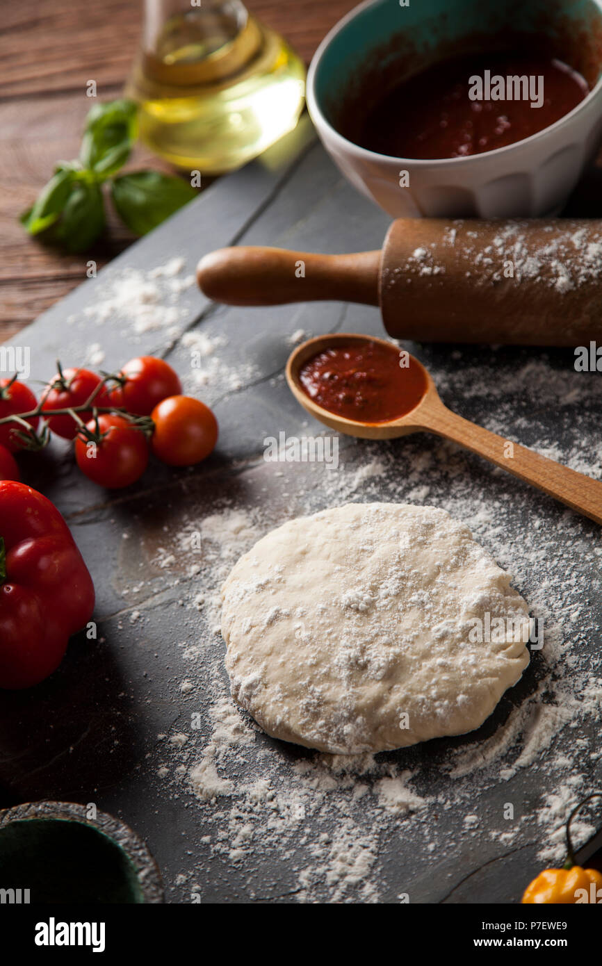 Homemade italian pizza preparation Stock Photo - Alamy