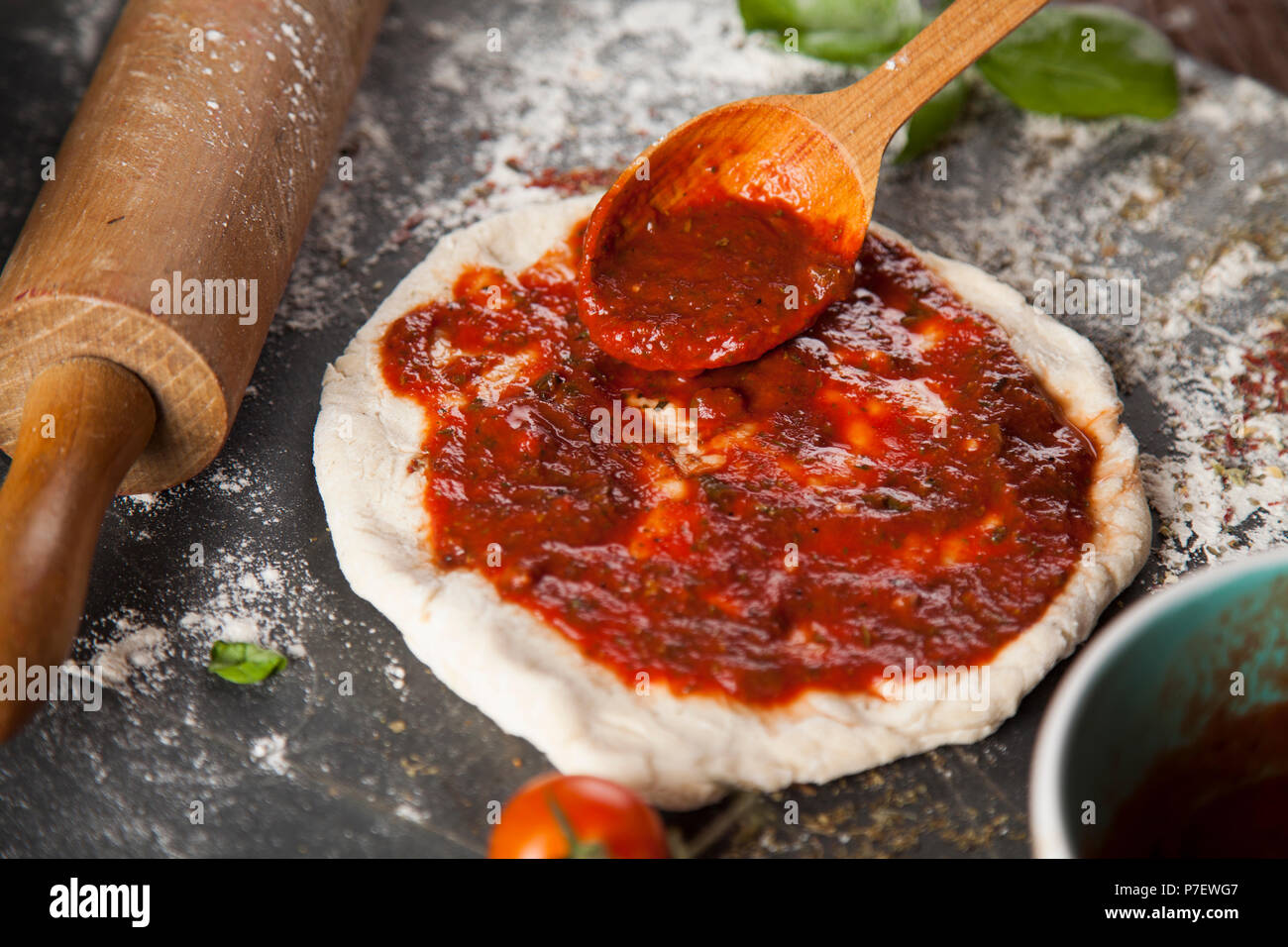 Homemade italian pizza preparation Stock Photo - Alamy