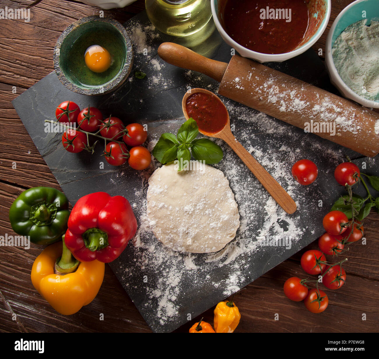 Homemade italian pizza preparation Stock Photo - Alamy