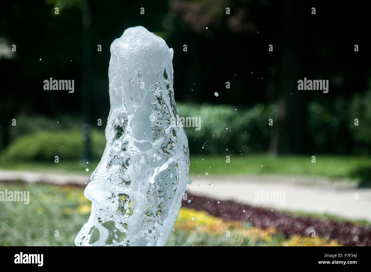 A close snapshot of gushing water with bizarre forms from a fountain in ...