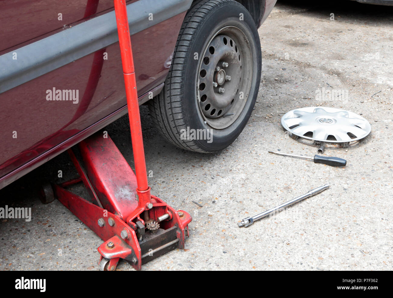 a MOTOR mechanic working on AND FIXING cars in north WEST London, UK ...
