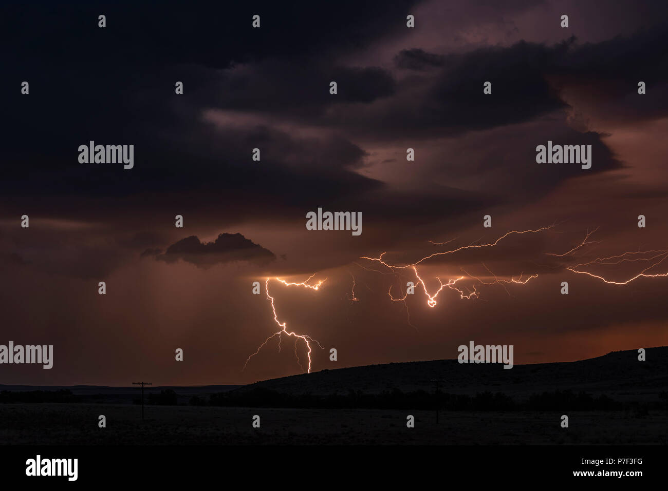 A nighttime, tornadic mezocyclone lightning storm shoots bolt of ...