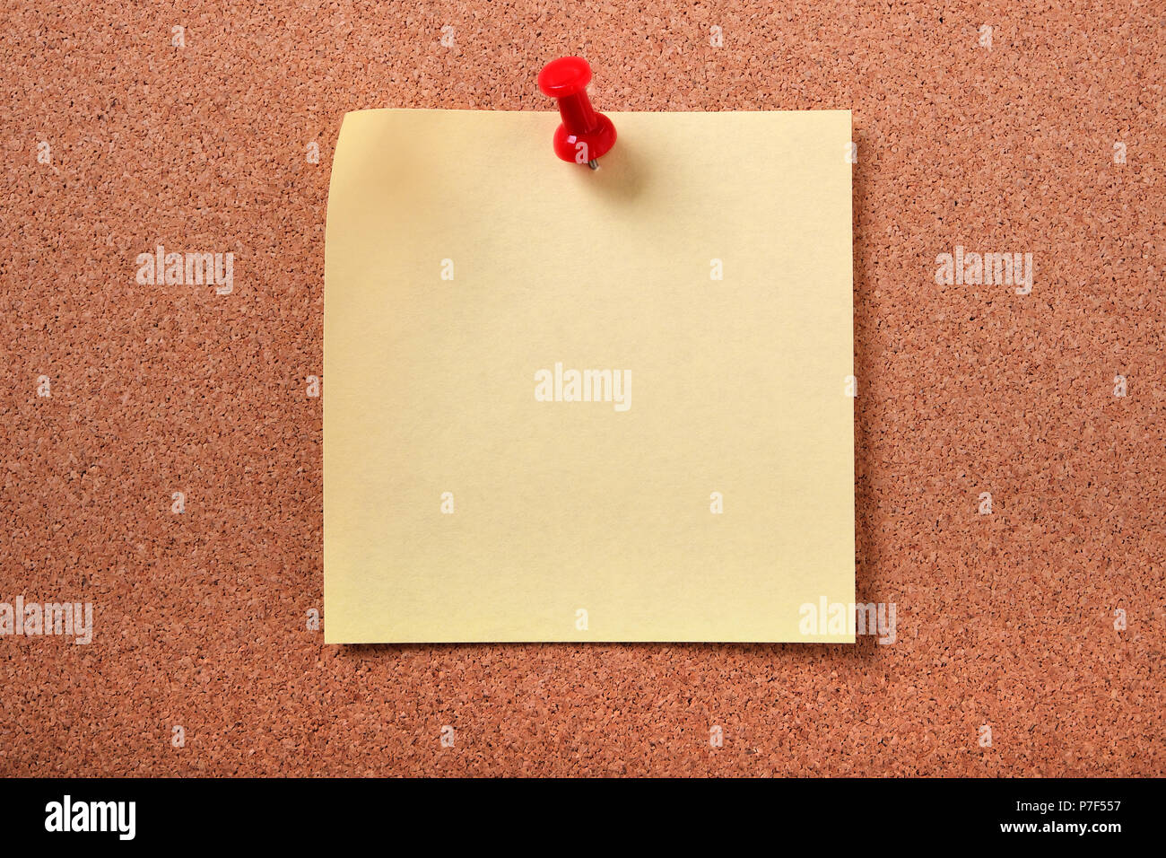 Yellow sticky post note pinned cork board Stock Photo - Alamy