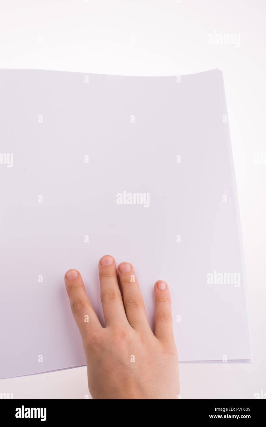 Hand holding a blank paper on a white background Stock Photo - Alamy