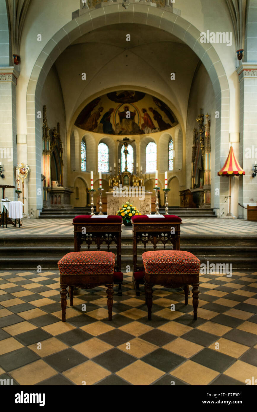 Wedding arrangement chairs inside The Basilica of St. Castor is the ...
