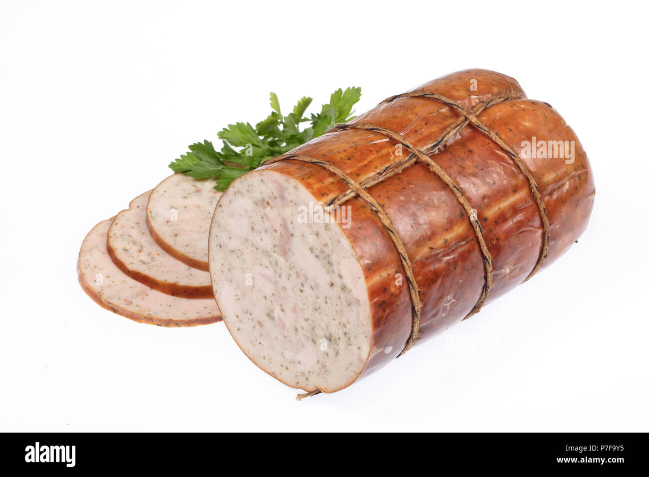 Sausge with greenery on an isolated studio background Stock Photo - Alamy