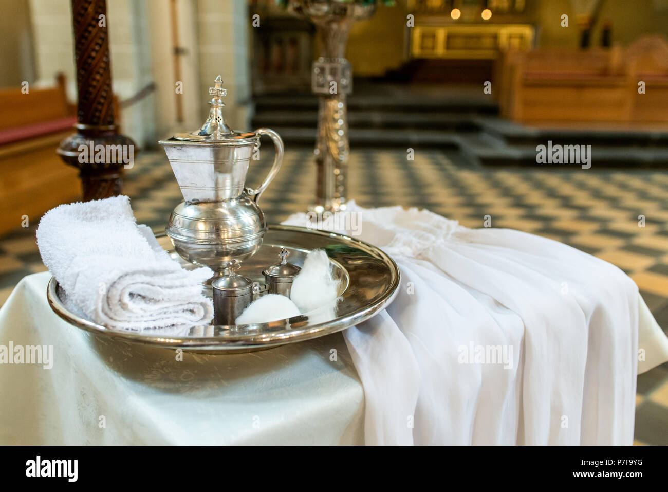 silver tray and jug with water accessories and a dress for baptism of ...