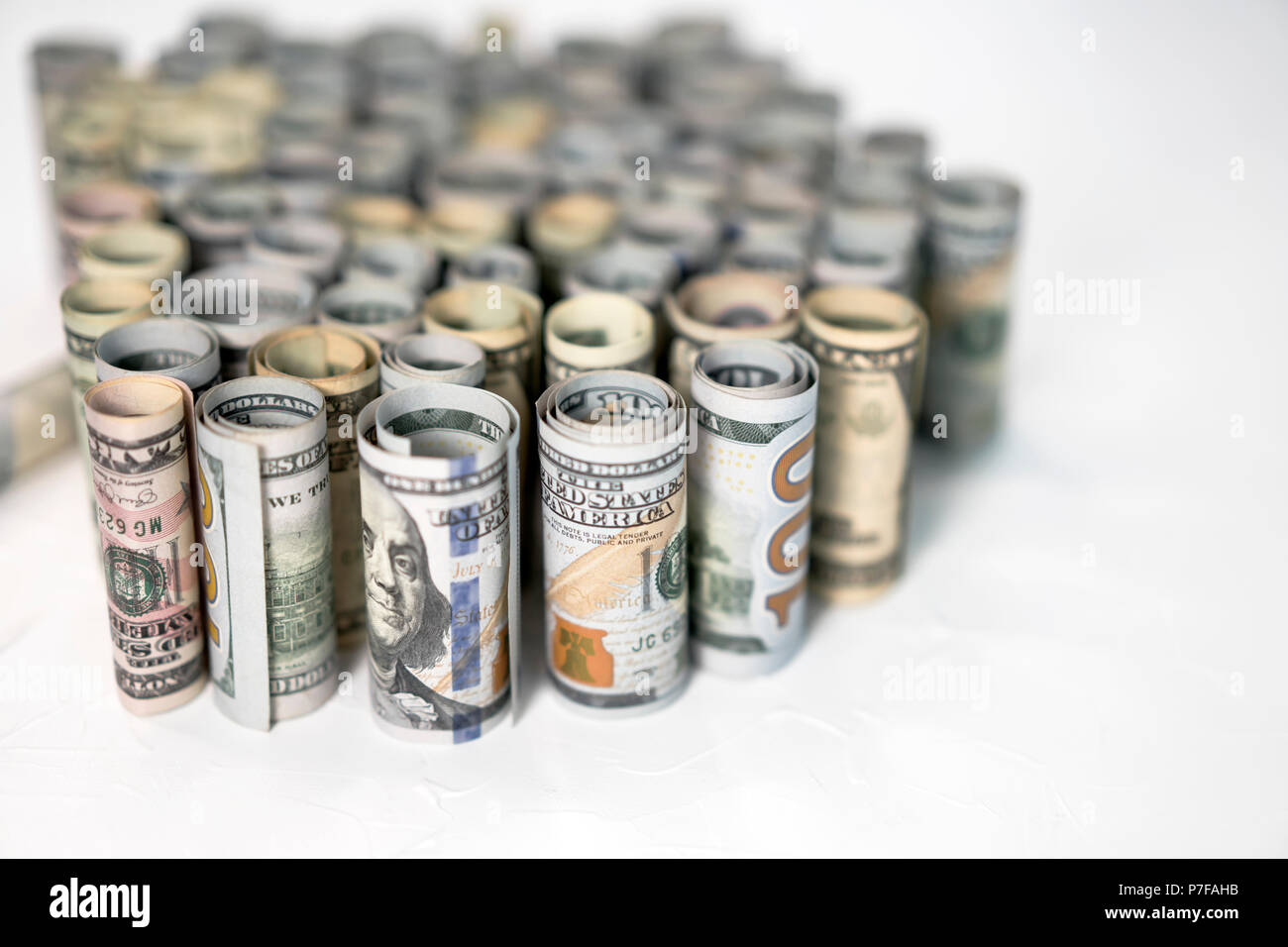 Rolled up dollar notes hi-res stock photography and images - Alamy