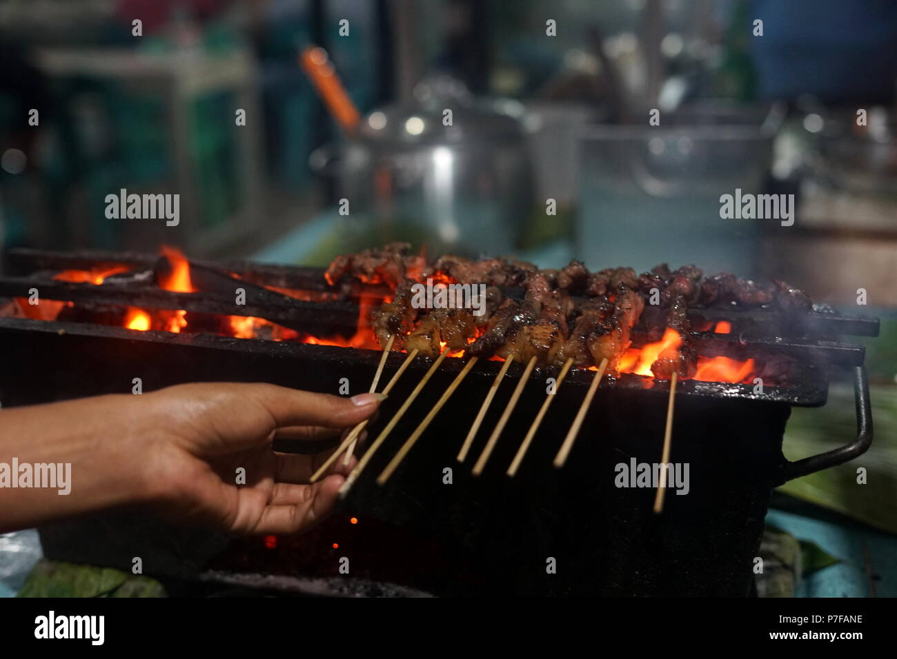 Food Vendor Grilling Meat Satay with charcoal at Street Food Market ...
