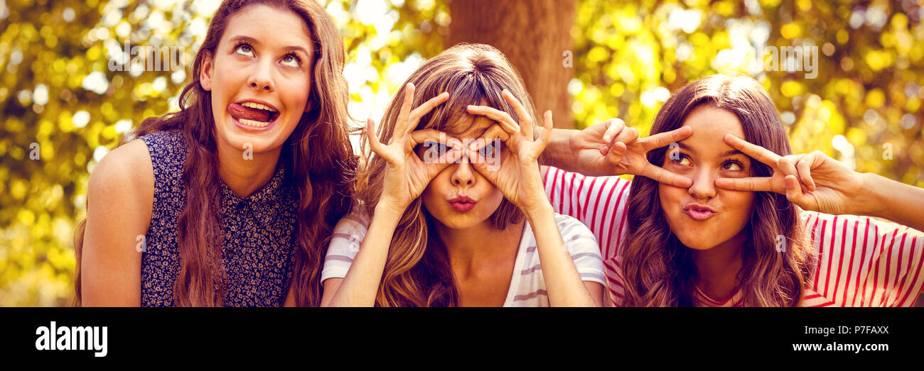 Happy friends making faces Stock Photo - Alamy