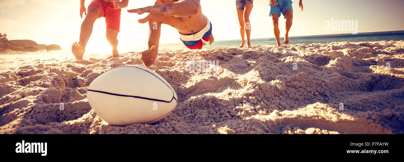 Friends playing rugby Stock Photo - Alamy