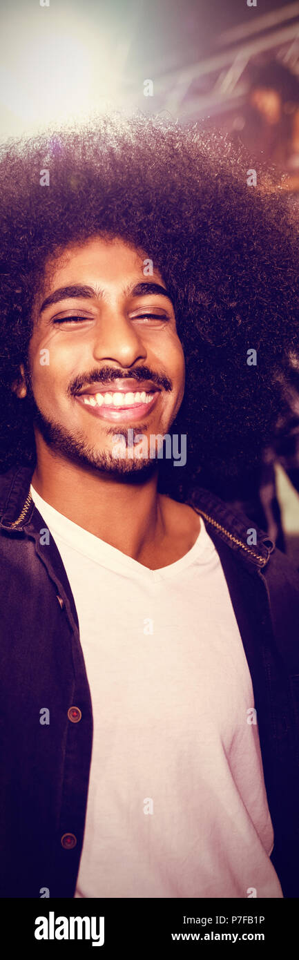Happy man with drink in nightclub Stock Photo - Alamy
