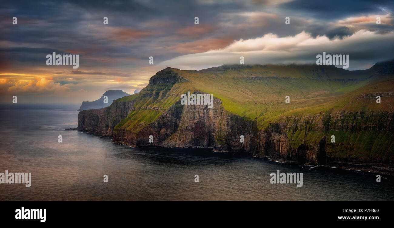 Cliffs of Eysturoy island in sunset light, Faroe Islands Stock Photo ...