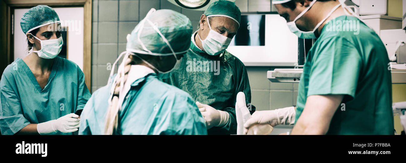 Surgery team working together Stock Photo - Alamy