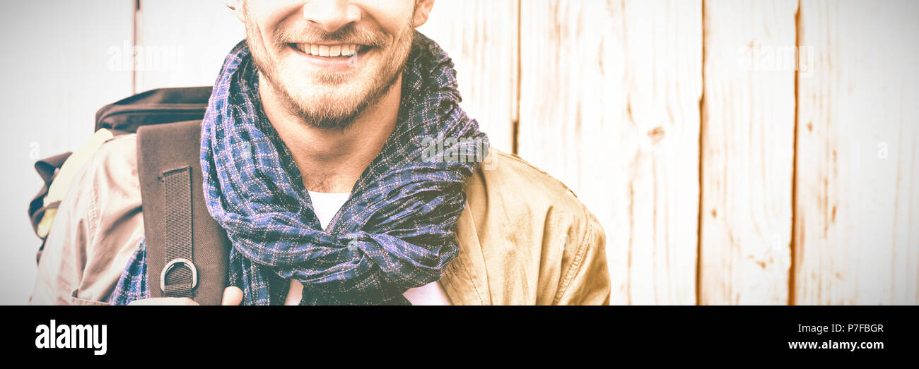 Young man carrying backpack Stock Photo - Alamy