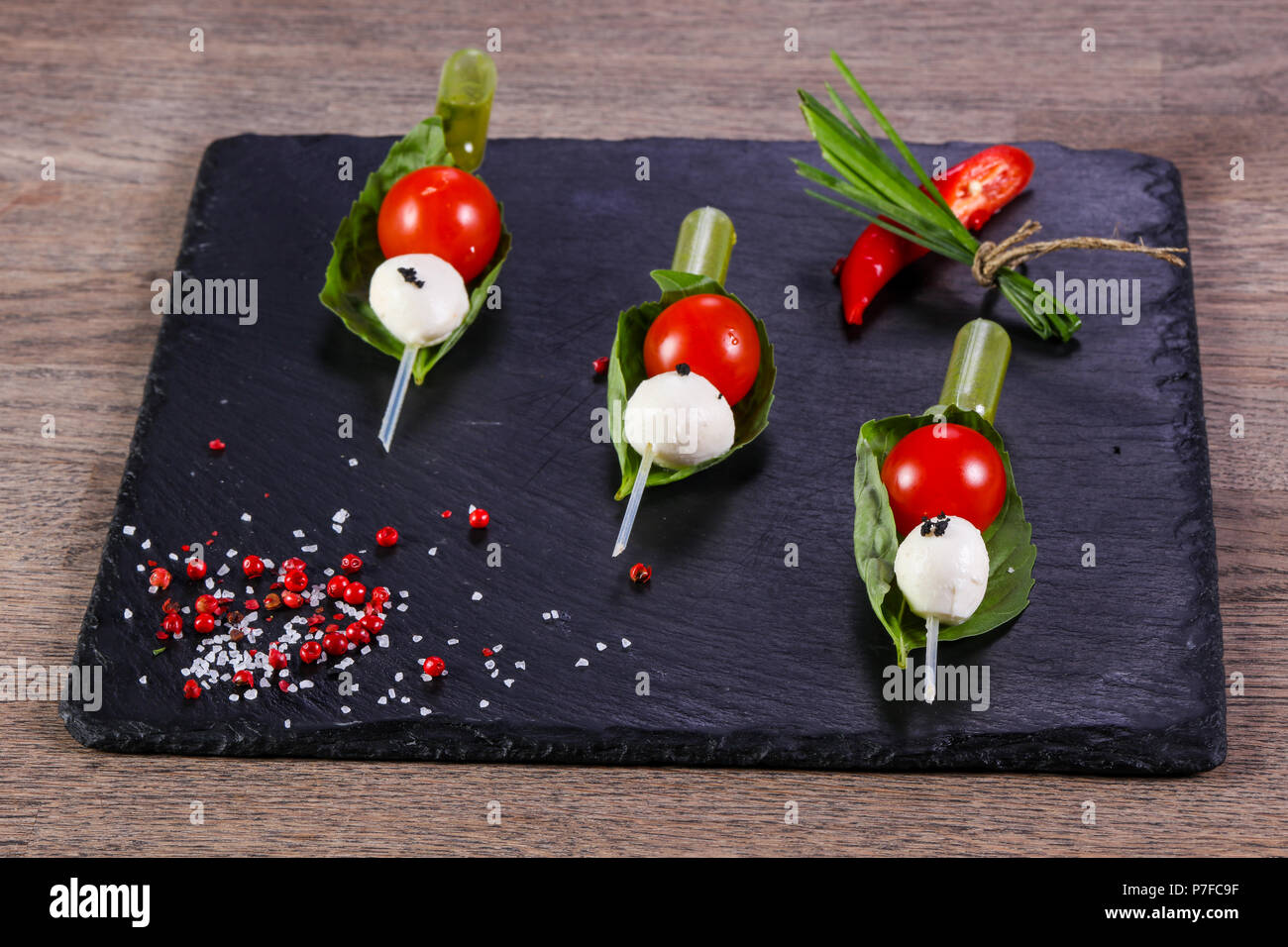 Canape caprese with olive oil Stock Photo - Alamy