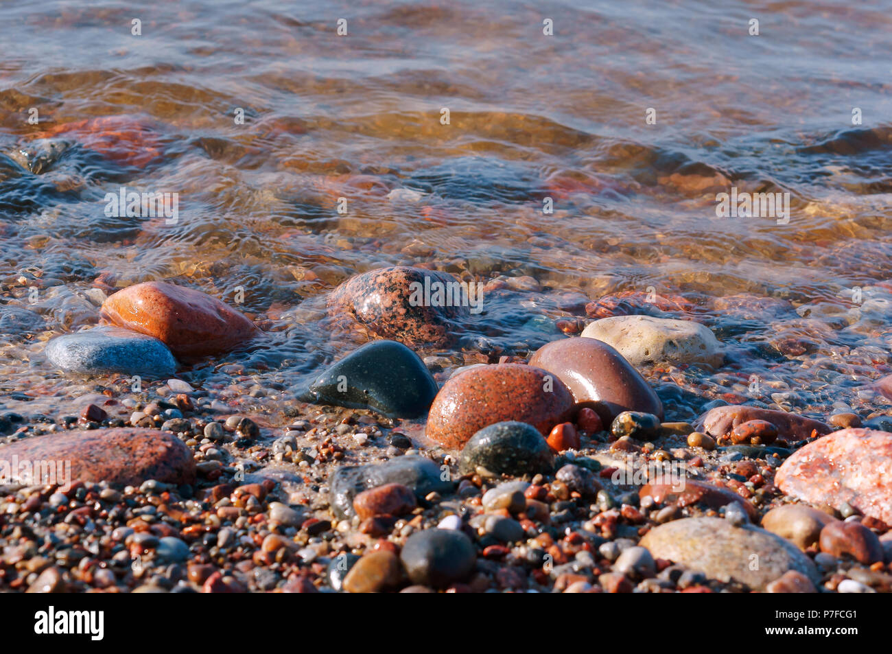 sea colored stones, rocky seashore, sea wave and pebbles Stock Photo ...