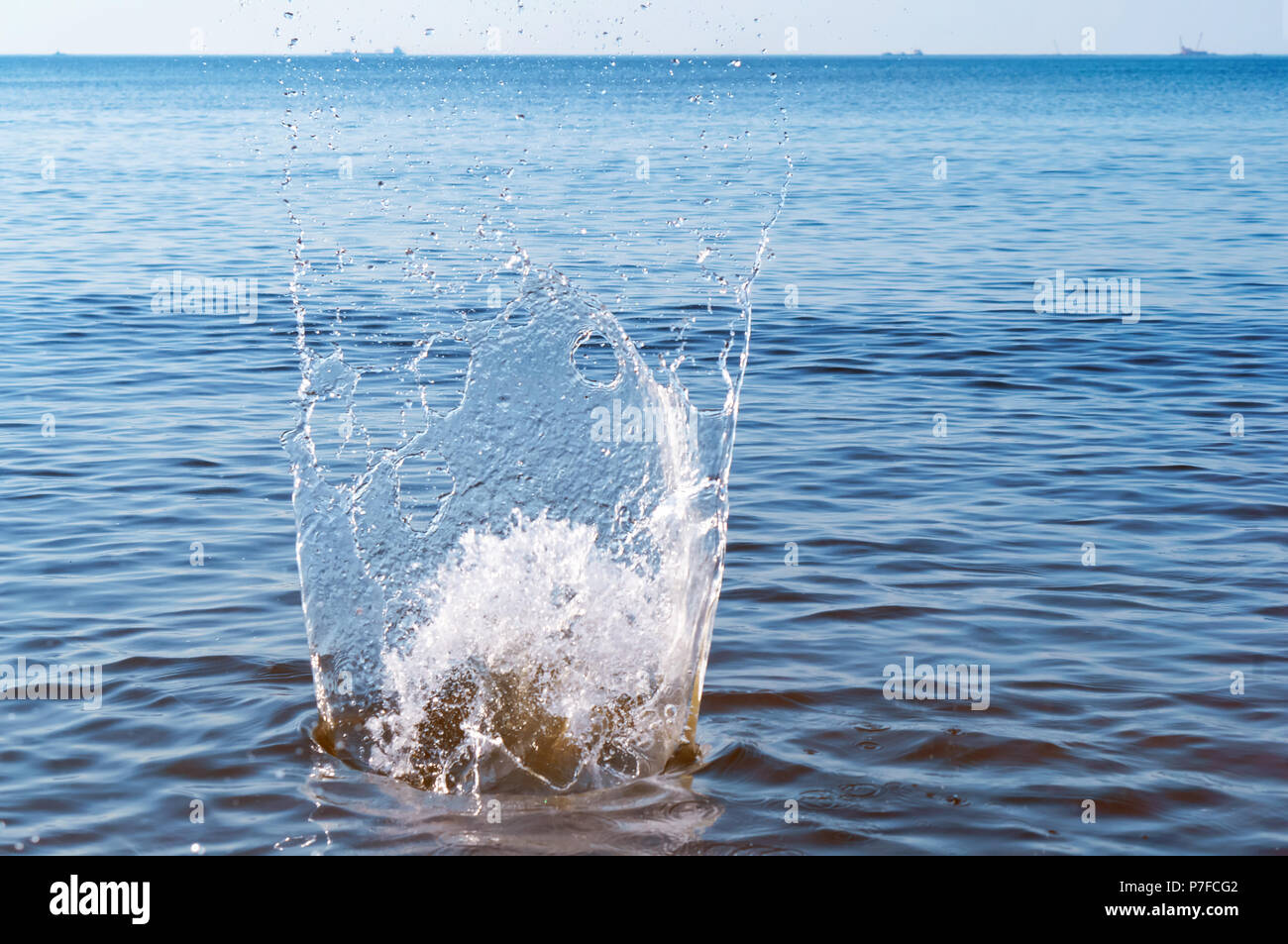 a splash of water, the explosion of the sea surface, flash water Stock ...