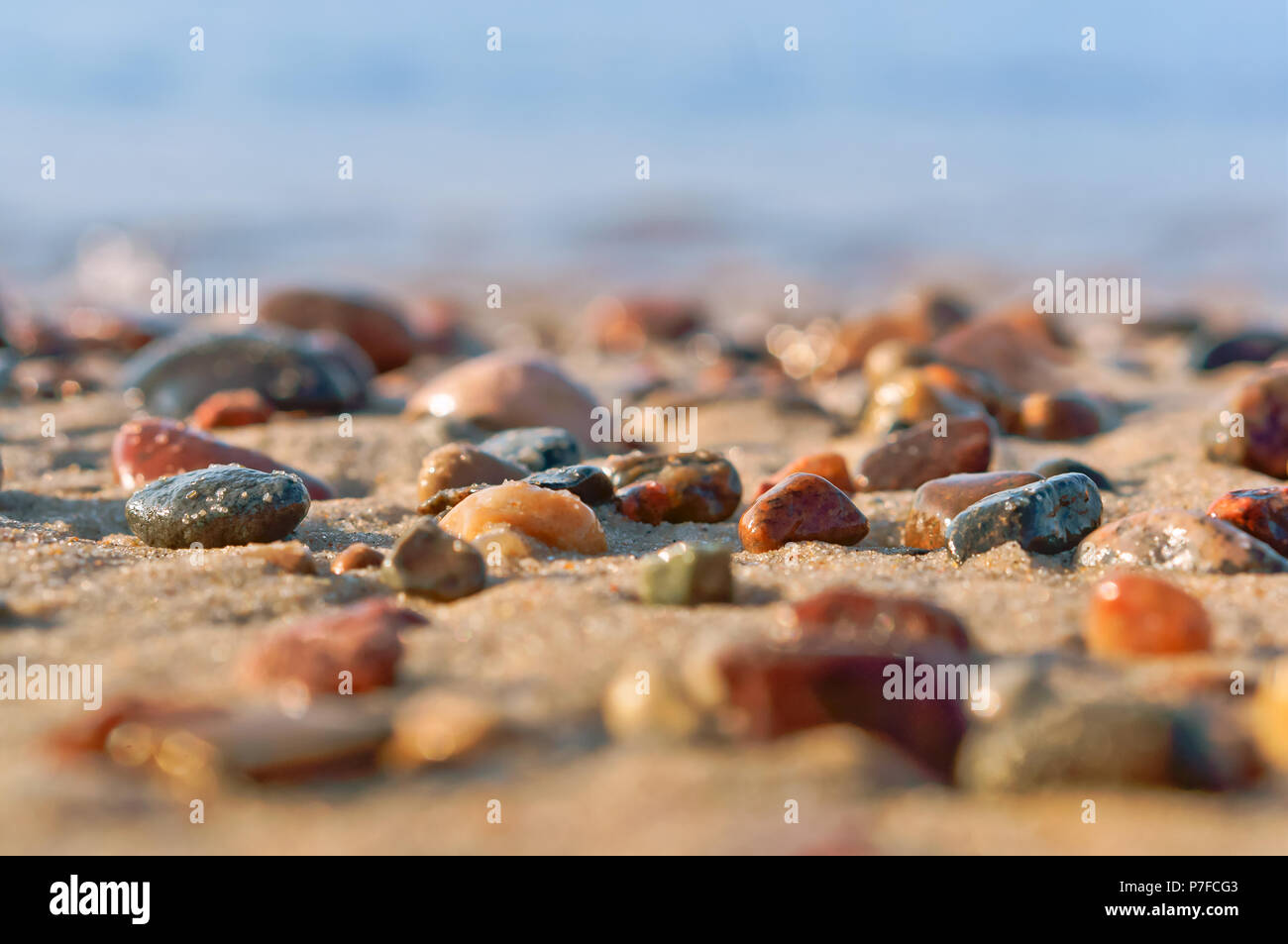 sea colored stones, rocky seashore, sea wave and pebbles Stock Photo ...